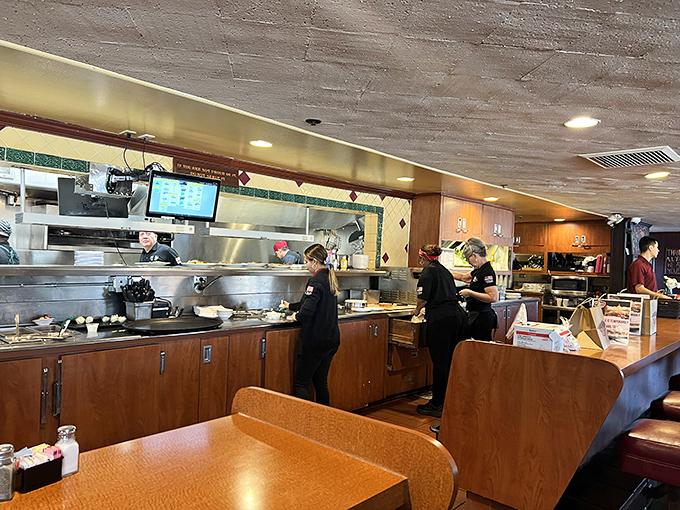 The open kitchen lets you witness the magic happening, where comfort food dreams become delicious reality.