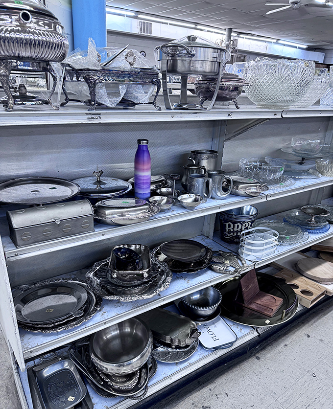 Silver serving pieces fit for Downton Abbey alongside practical cookware. That purple water bottle is the millennial touch in this treasure trove of tradition.