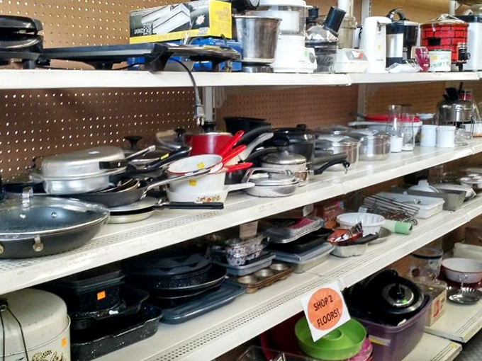 Kitchen implements galore! From barely-used wedding registry pans to well-seasoned cast iron that's outlived several marriages &ndash; cooking history on display.