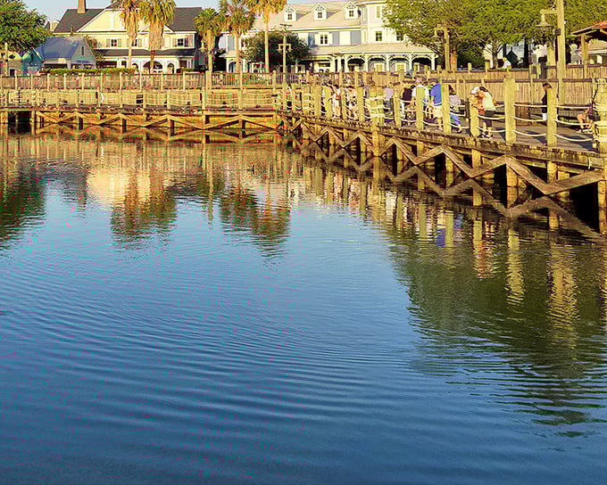 The boardwalk at Lake Sumter Landing offers sunset strolls that rival any coastal town, proving paradise doesn't require an ocean view.