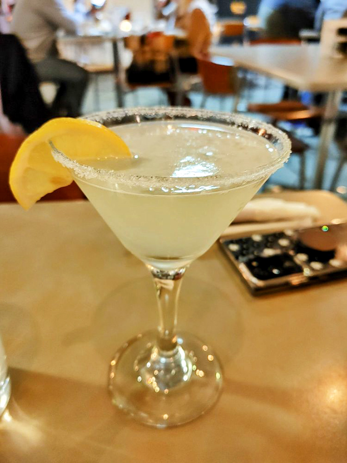 This isn't just a lemon drop martini; it's liquid sunshine with a sugar rim, the perfect companion while deciding which seafood treasure to order next.