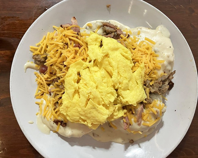 This isn't just breakfast&mdash;it's breakfast with ambition. Eggs, cheese, and sausage gravy creating a morning masterpiece that laughs in the face of hunger.