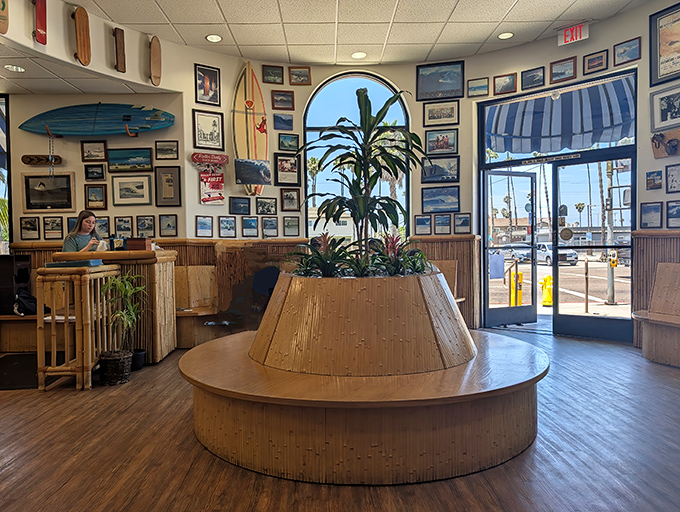 The central plant island isn't just decor&mdash;it's a tropical oasis surrounded by surf memorabilia and hungry breakfast enthusiasts plotting their day.