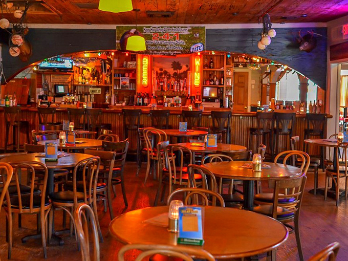 The bar area: where fishing stories get 40% more impressive with each round of rum runners. Those red bar stools have heard it all.
