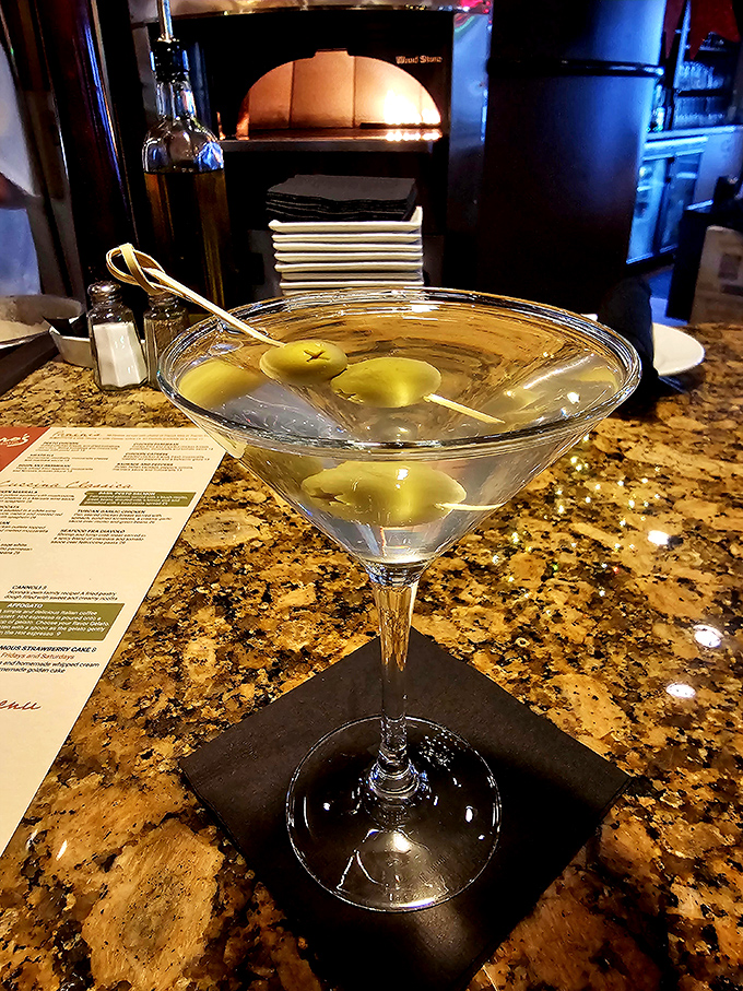 A martini so classic and pristine it could teach a masterclass in cocktail elegance&mdash;those olives are just showing off.