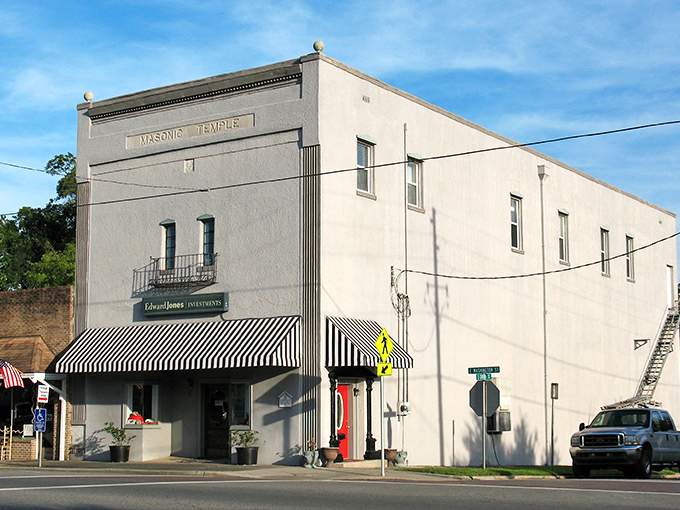 Masonic mysteries and striped awnings. This temple has probably seen more secret handshakes than a presidential campaign trail.