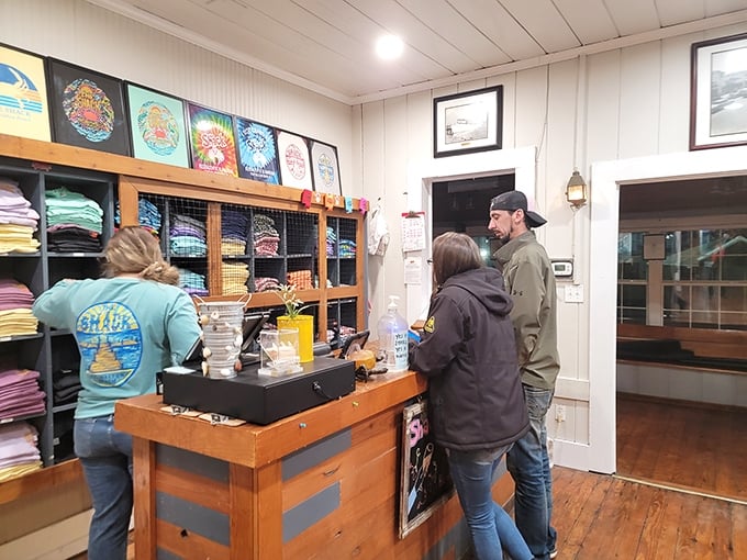 The merch counter: where you can buy a t-shirt to prove you were here, because your seafood food coma stories need backup.