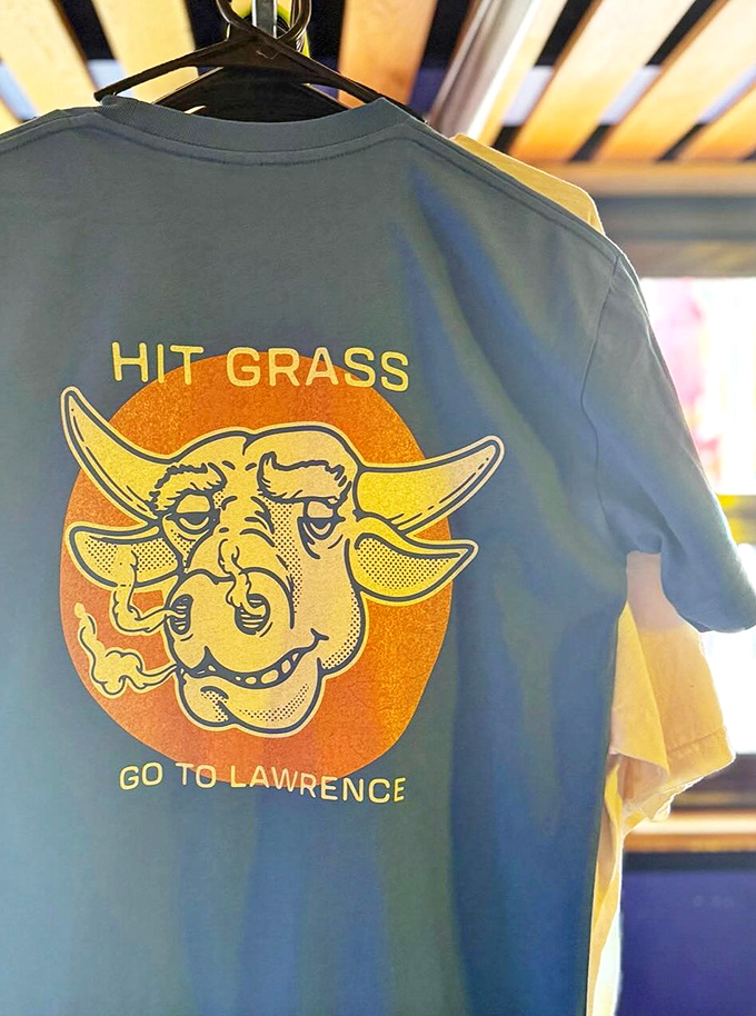 Not just merch&mdash;it's wearable BBQ philosophy. "Hit Grass, Go to Lawrence" might be the best advice you'll get all year. 