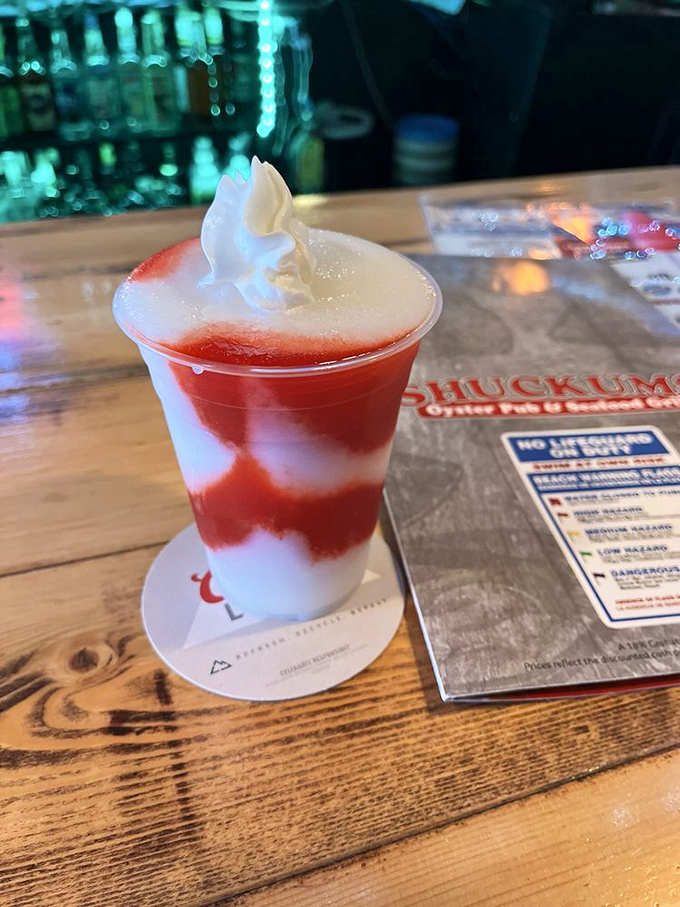 A Miami Vice that looks like a sunset in a glass. The whipped cream on top isn't just garnish&mdash;it's the cloud floating above your personal paradise.
