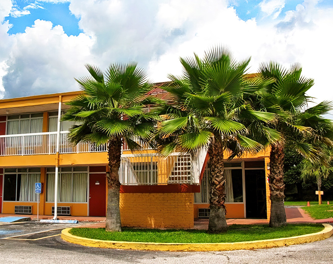 Palm trees stand sentinel at this retro motel, a splash of Florida orange against blue skies &ndash; lodging with character that chain hotels can only dream about.