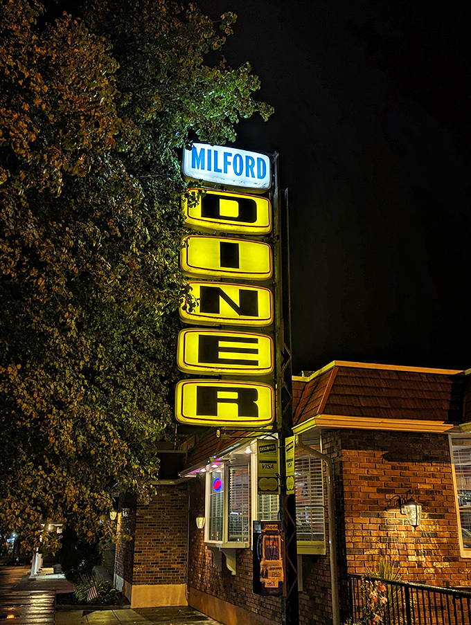The Milford Diner's vintage sign glows like a beacon for night owls and early birds alike. Neon never goes out of style in diner-land.