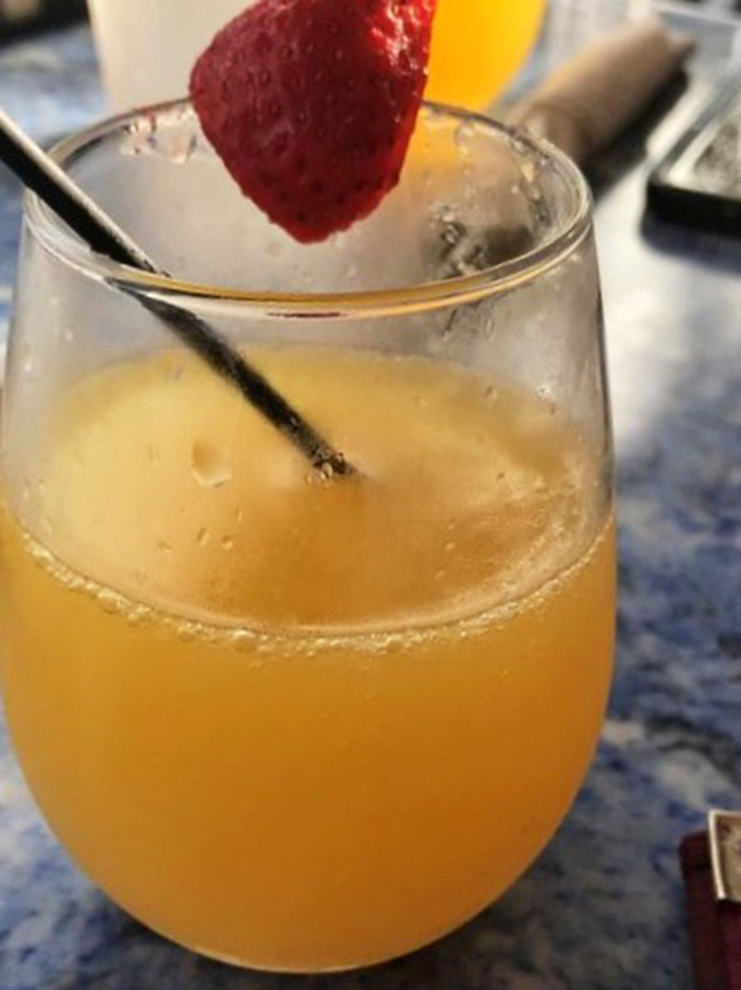 Sunshine in a glass with a berry on top. This mimosa isn't just a brunch cocktail&mdash;it's Florida's liquid personality.