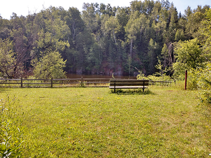 Nature's therapy session awaits at this peaceful shoreline, where a simple bench offers the best seat in the house for absolutely nothing per hour.