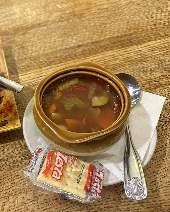 A soup that doesn't just warm your body but hugs your soul, served with crackers that have been patiently waiting for their moment to shine.