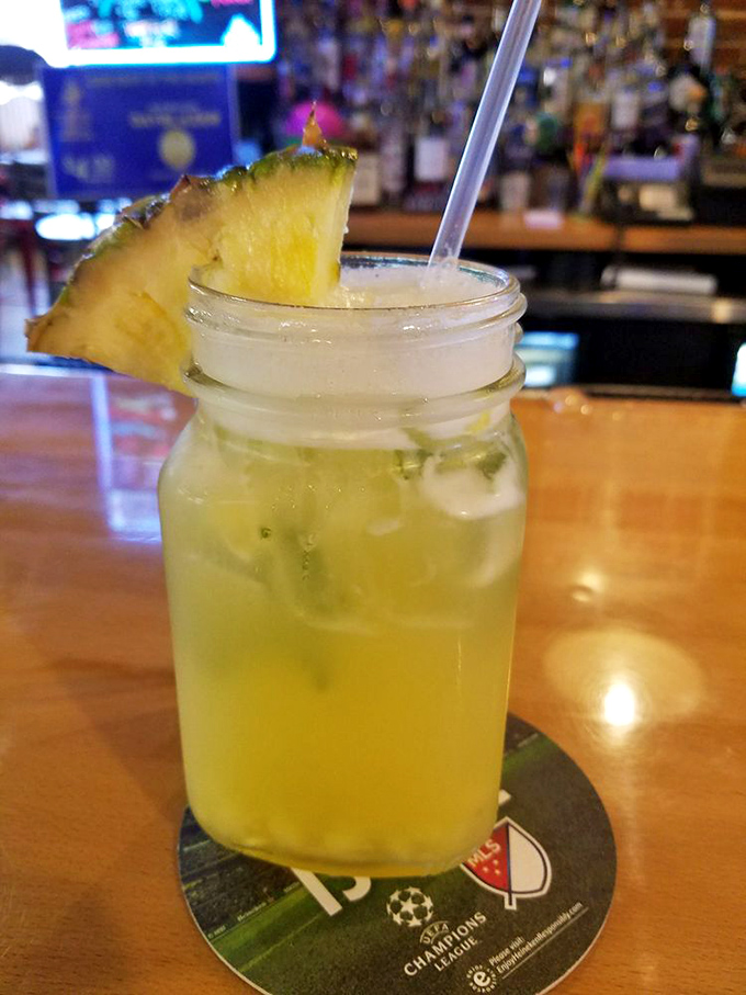 A mason jar mojito with fresh pineapple &ndash; because nothing cuts through BBQ richness like a bright, tropical sipper.