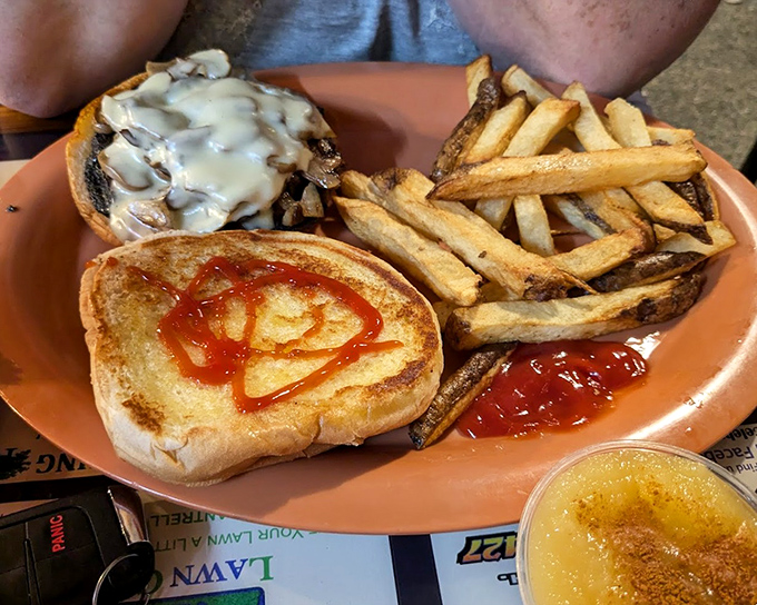 A burger that's had mushrooms and Swiss cheese fall madly in love on top of it. The kind of sandwich that requires strategic eating.