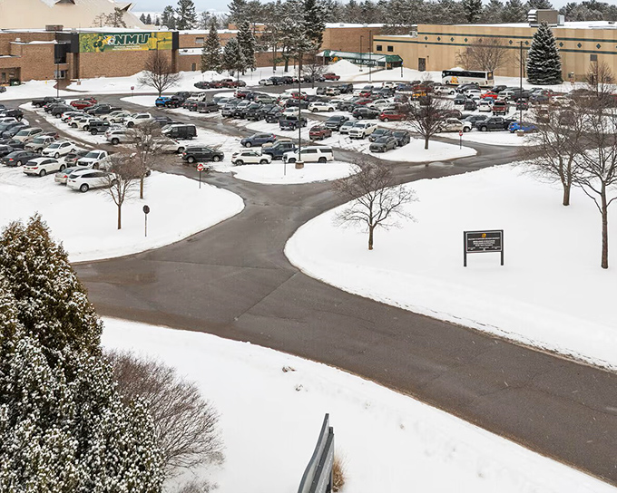Northern Michigan University's campus embraces winter with well-cleared pathways cutting through pristine snow, where education continues regardless of weather's whims.