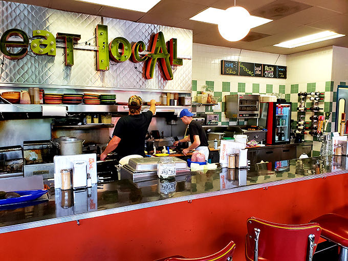 An open kitchen where culinary magic happens in full view – no smoke, no mirrors, just honest cooking with a side of showmanship.