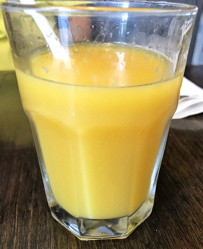 Orange juice so vibrantly colored it looks like Florida sunshine decided to take liquid form just for your breakfast pleasure.