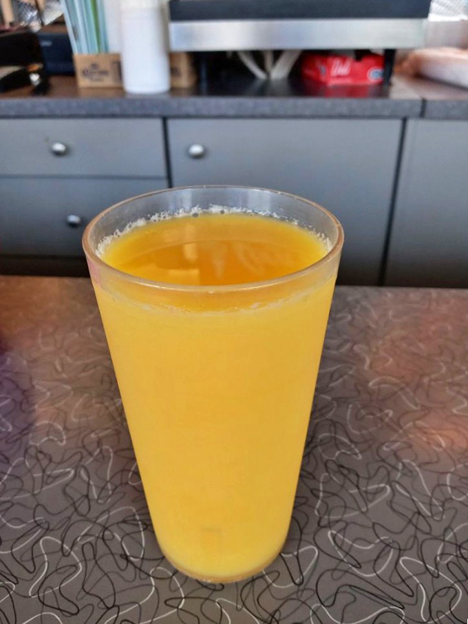 Fresh-squeezed sunshine in a glass. This orange juice probably traveled fewer miles to your table than you did to the diner.