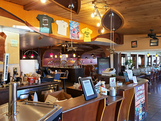 Where artichoke magic begins. The order counter's warm wood tones and artichoke-themed decor set the stage for the culinary adventure ahead.