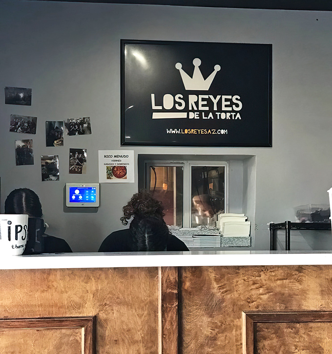 Behind this counter, culinary magic happens. The crown logo watches over everything, ensuring royal treatment for every order.
