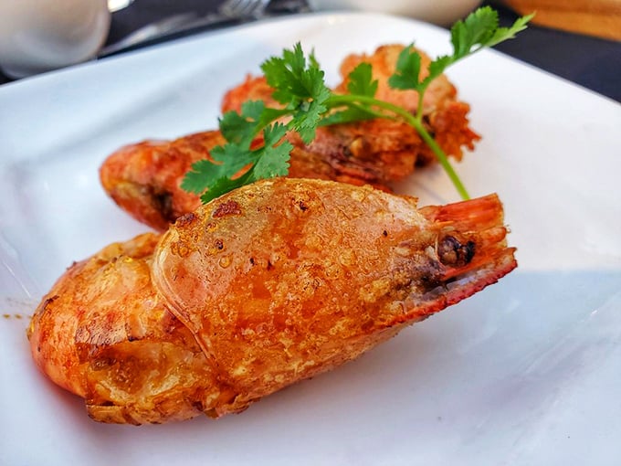 These prawns look like they've been simmering in a sauce so good, they're blushing. The cilantro garnish is just showing off at this point.