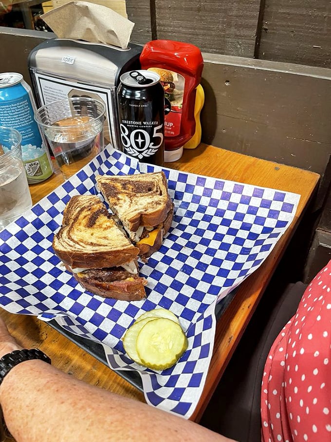 The patty melt: where grilled bread, melted cheese, and seasoned beef come together in a sandwich that would make your cardiologist nervous but your soul happy.