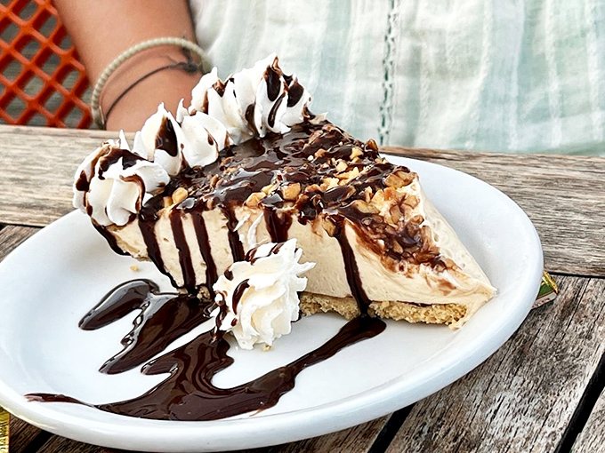 A peanut butter pie that makes you question why you ever save room for anything else. Chocolate drizzle performing gravity-defying magic.