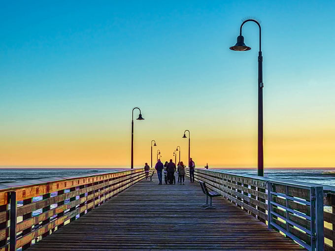 Sunset strolls on Cayucos Pier&mdash;where strangers become temporary friends united by nature's nightly masterpiece over the Pacific.