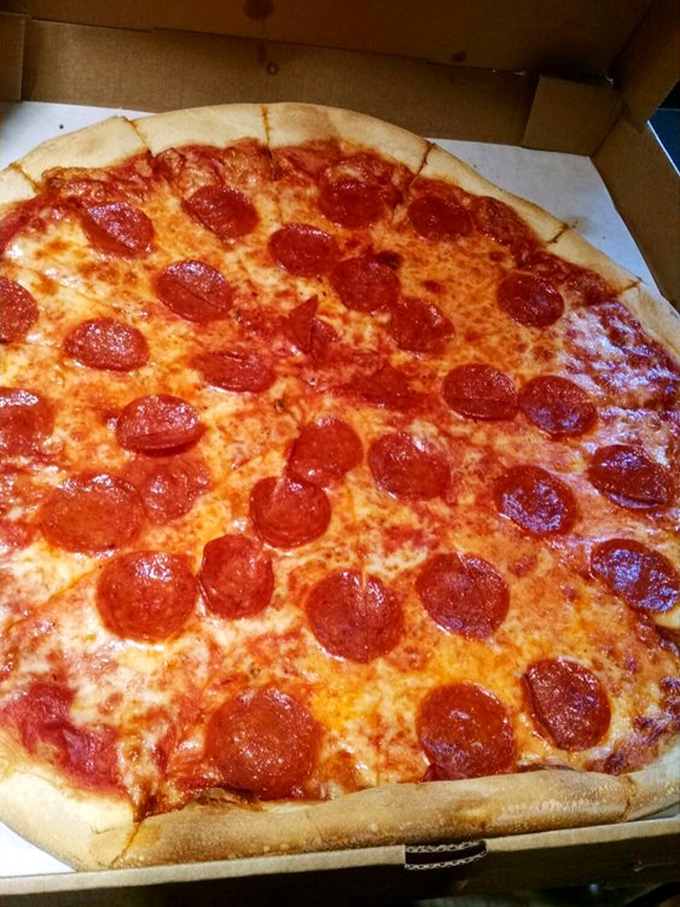 Pepperoni that curls into perfect little flavor cups, creating tiny pools of spiced oil. This is pizza engineering at its finest.