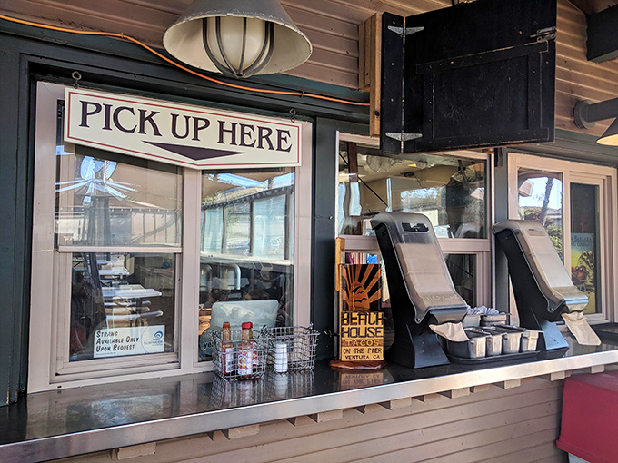 The "Pick Up Here" window—where dreams come true and patience is rewarded with paper-wrapped bundles of coastal deliciousness.