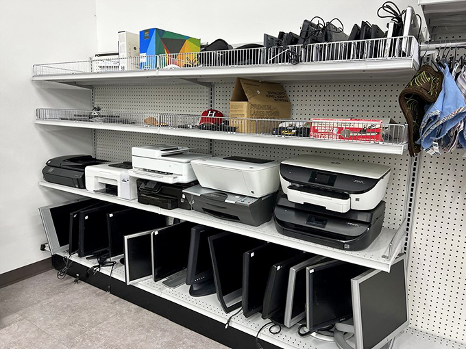 Printers and monitors stand at attention like technological soldiers, ready to serve in home offices across Tucson.