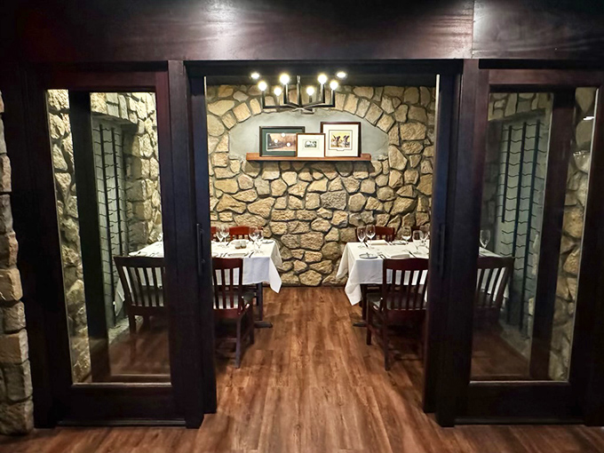 Stone walls embrace intimate tables in this private dining space, perfect for celebrations or plotting world domination over excellent seafood.