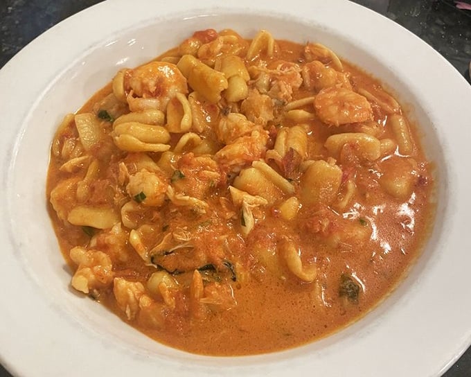 Pasta with seafood that's having a party and everyone's invited. The sauce alone could make you propose to the chef.