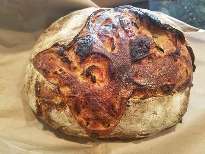 This artisanal loaf tells a story of patience. Those beautiful blisters and rustic shape? That's bread with character and a complex backstory.