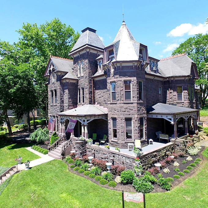 Reynolds Mansion's Gothic Revival towers reach skyward like a fairy tale castle that decided Pennsylvania was home.
