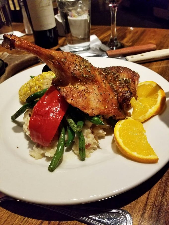 This duck isn't just roasted; it's honored. The crispy skin and tender meat perched atop mashed potatoes creates a plate worth remembering.