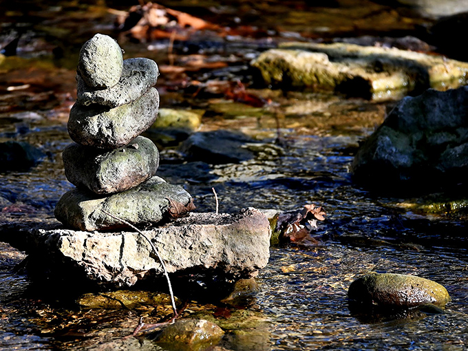 Someone's been playing nature's version of Jenga in the stream&mdash;a meditative stack of stones marking "I was here" without leaving a trace.