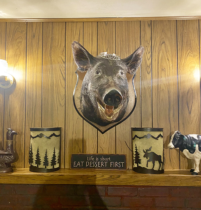 That sign says "Eat Dessert First"&mdash;possibly the wisest advice you'll ever see mounted next to a wild boar on a wall.
