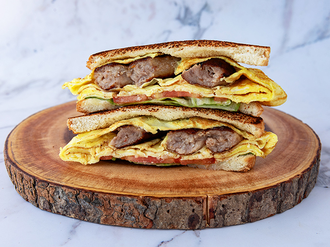 A breakfast sandwich that understands the importance of proper architecture&mdash;every ingredient in perfect balance. The morning commute's best friend. 