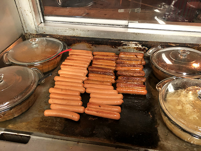 Hot dogs in their natural habitat, sizzling toward greatness. Like watching Picasso mix paint before creating a masterpiece.