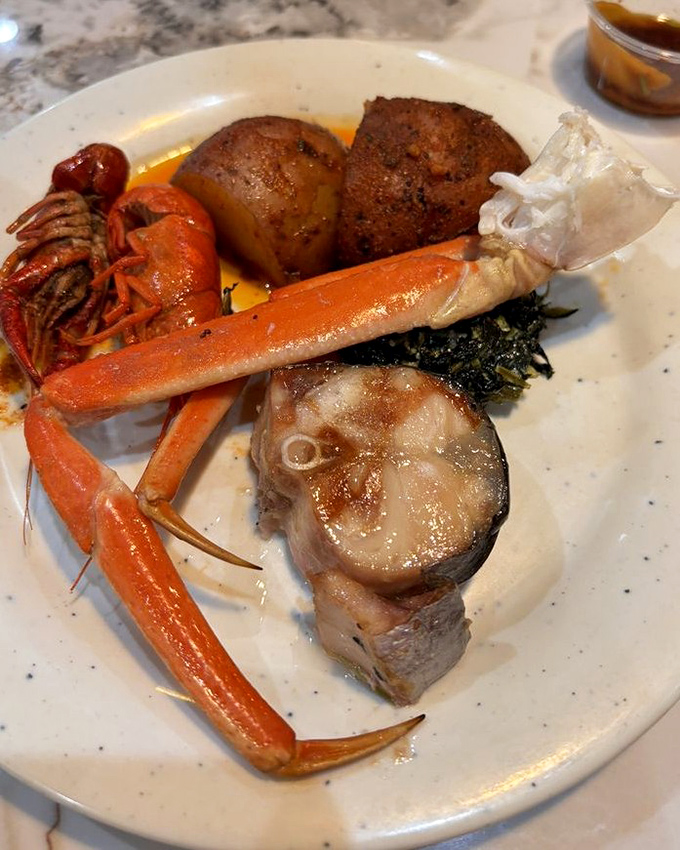 Snow crab legs and fish steaks&mdash;the crown jewels of any seafood buffet. This plate is what seafood dreams are made of.
