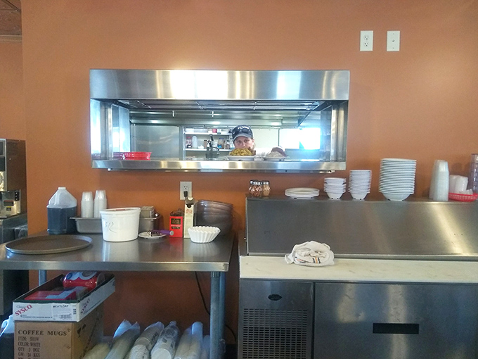 Where the magic happens&mdash;a kitchen window offering glimpses of culinary choreography that's been perfected over decades, not culinary school.