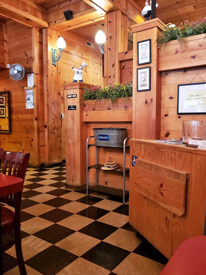 The checkered floor leads to wooden warmth where chef figurines stand guard over the dining room like tiny, white-hatted sentinels.