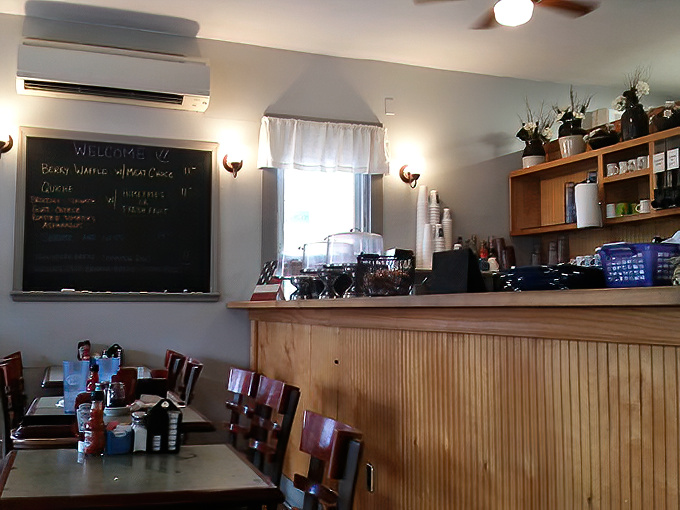 The service counter showcases fresh desserts like edible jewels, tempting even the most disciplined sweet tooth.
