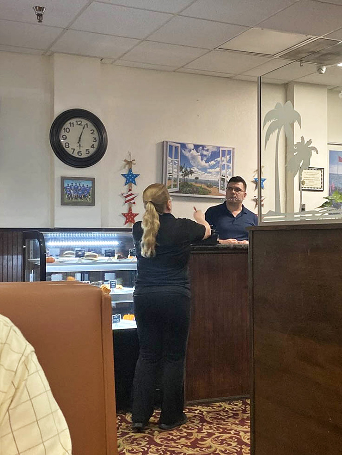 The service counter where coffee cups never run empty and conversation flows as freely as the refills.