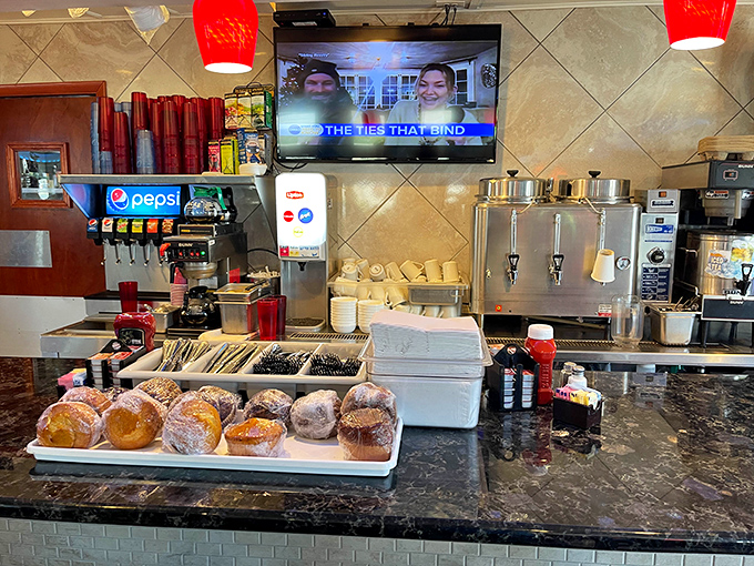 The beating heart of any great diner: a counter where donuts, coffee urns, and friendly service create morning magic.