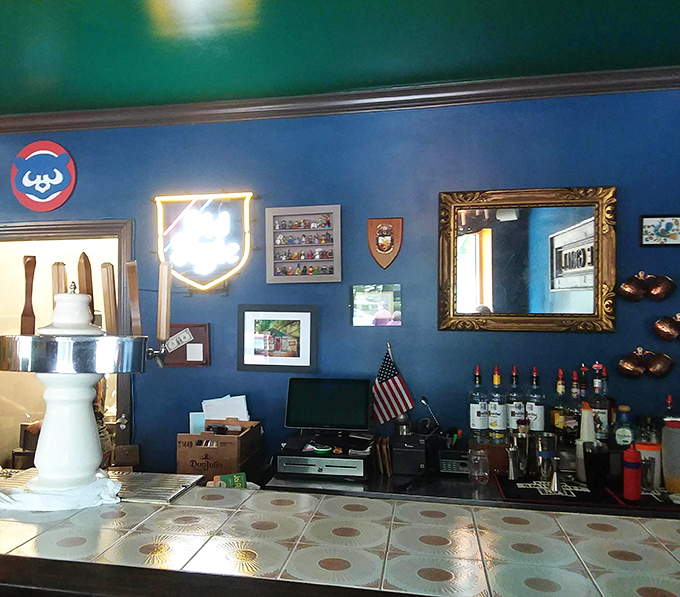 The bar area, with its blue walls and eclectic d&eacute;cor, feels like the coolest corner of your most interesting friend's house.