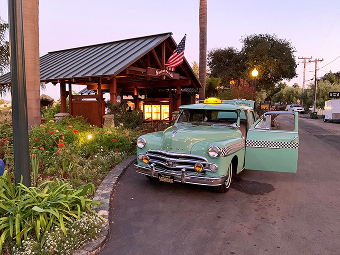 A vintage mint-green taxi waits outside Shadowbrook, ready to transport diners back to a time when arriving in style wasn't optional.